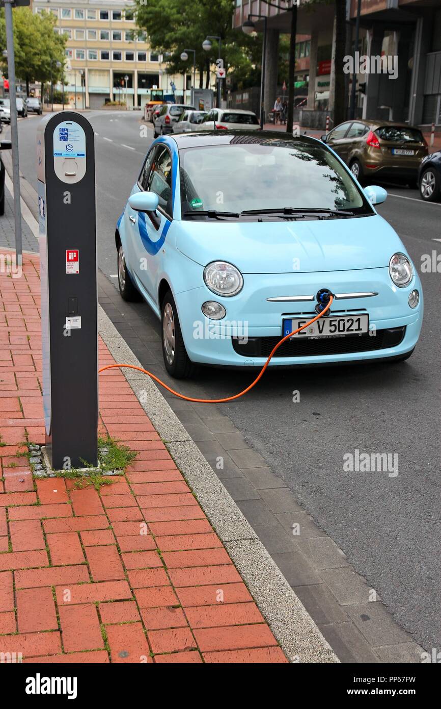 DORTMUND, GERMANY - JULY 15: Electric car is being charged on July 15 ...