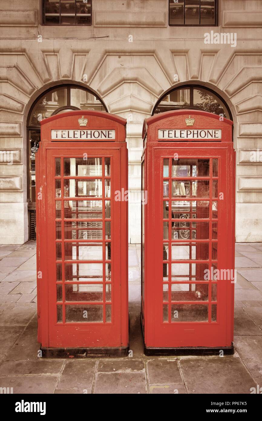 London, United Kingdom - red telephone booths. Phone boxes. Cross ...