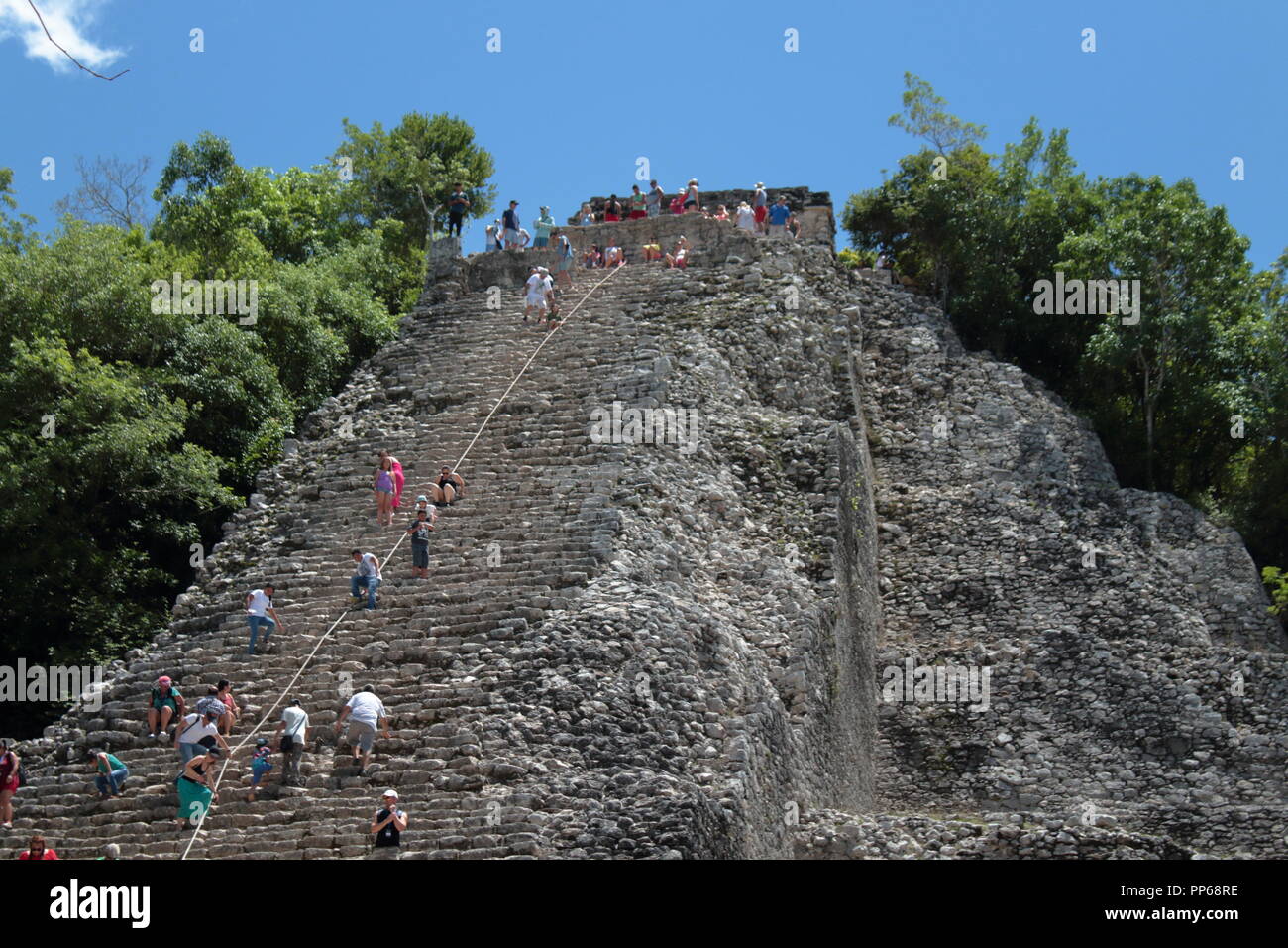 tourists who visit the archaeological site of Coba in Mexico with its ...