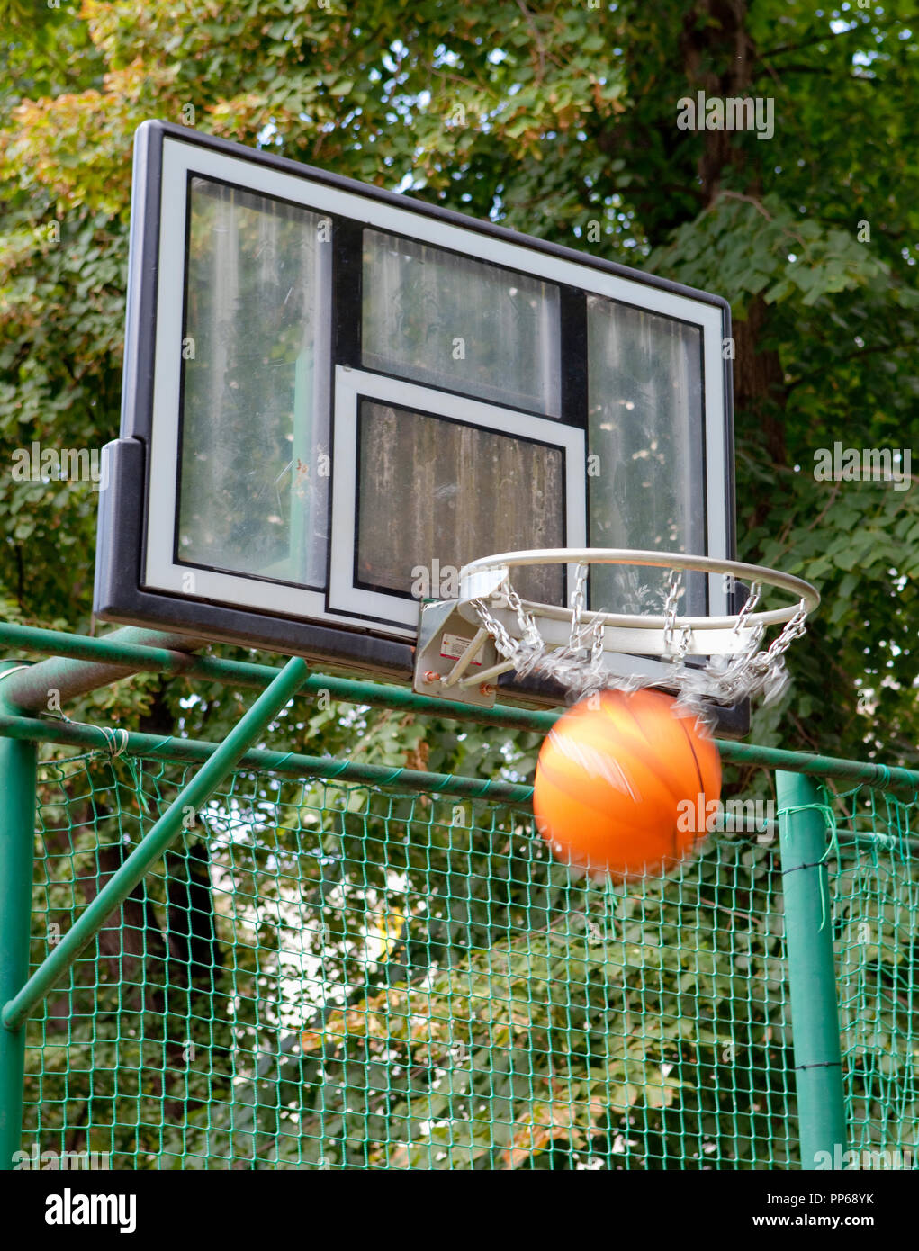 Basketball Board with Basket and Orange Ball Outdoors Stock Photo - Alamy