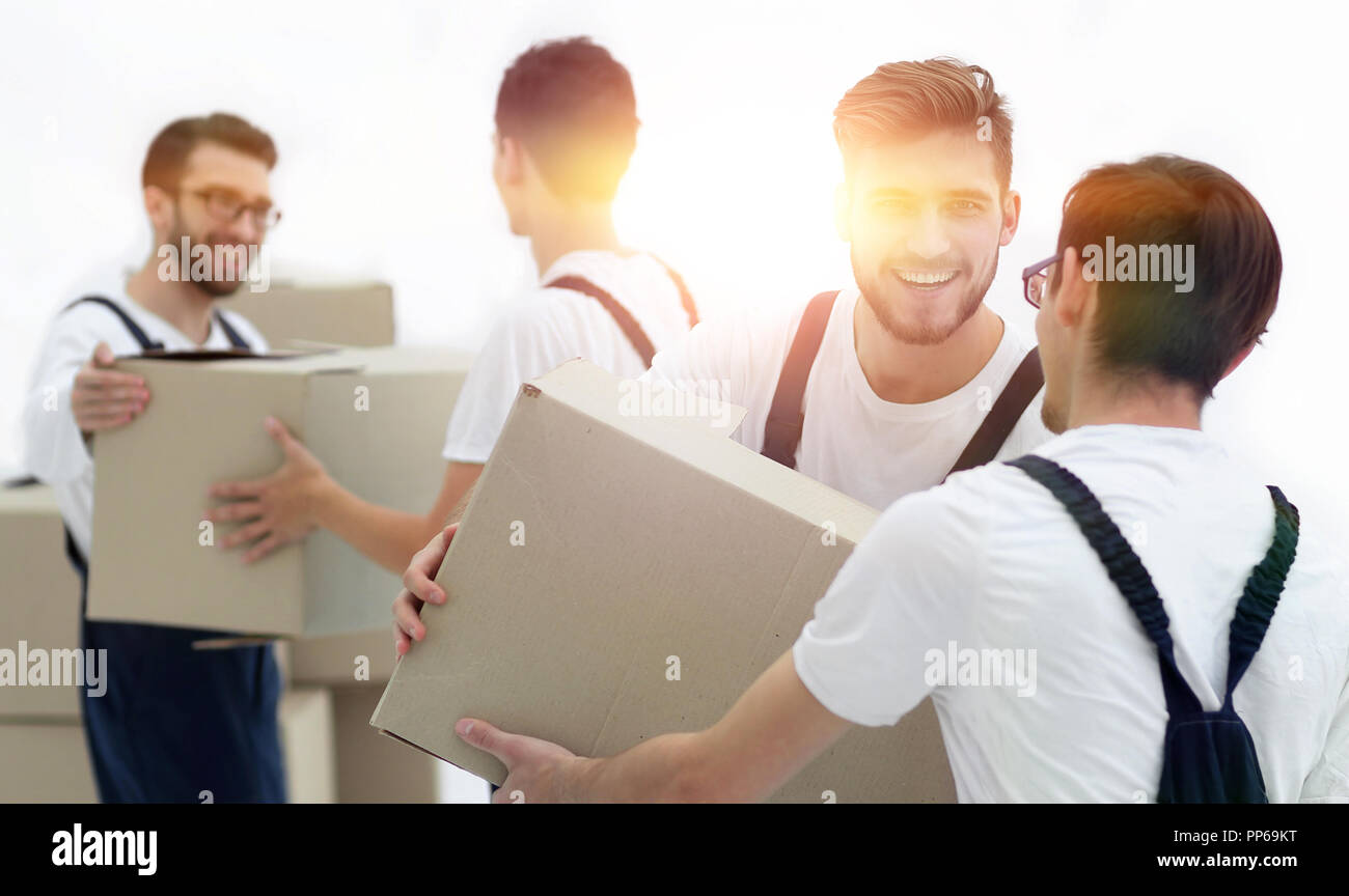Men delivering box isolated on white Stock Photo - Alamy