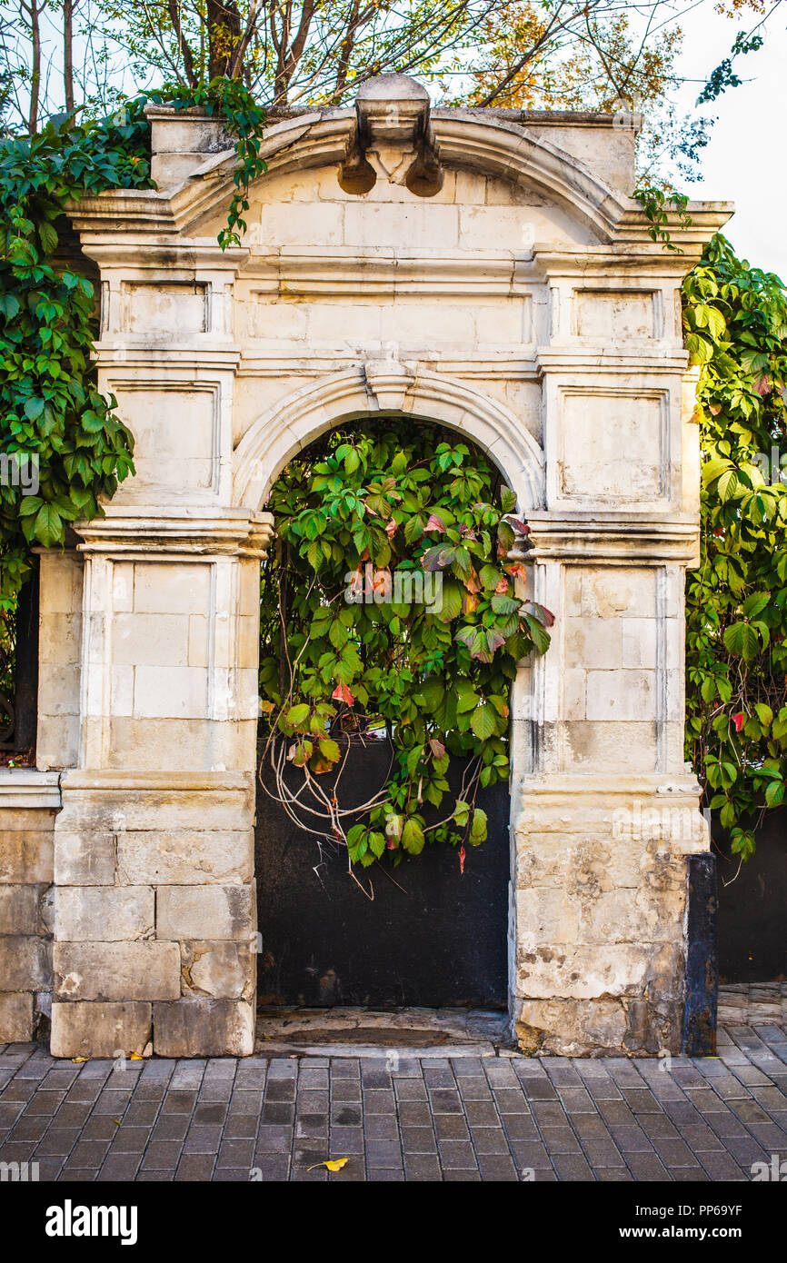 Stone arch in the spring garden in Moscow, Russia. Beautiful ...