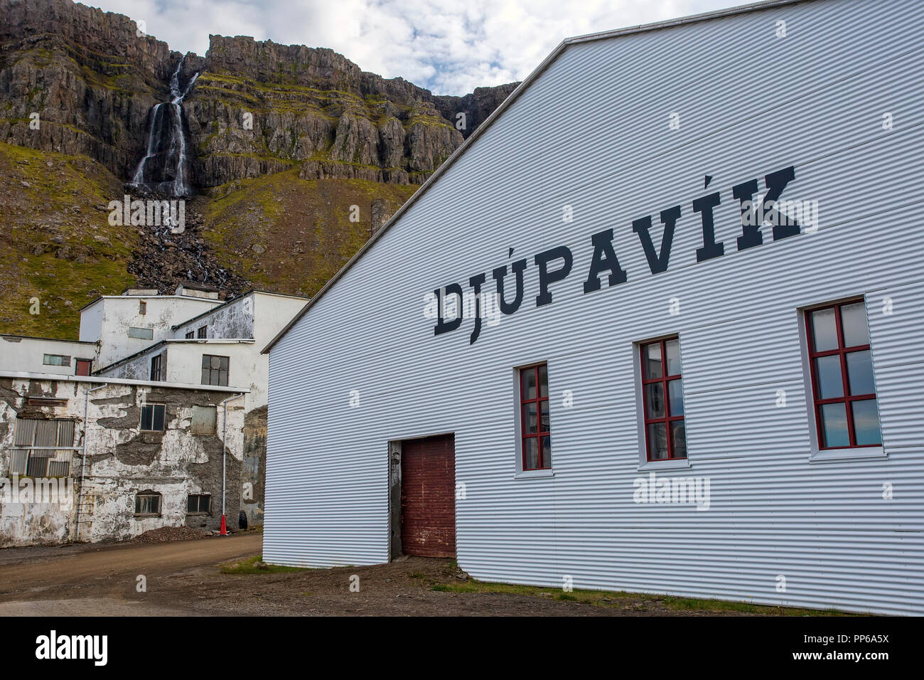 An old factory located in Djúpavík, Iceland. The waterfall in the ...