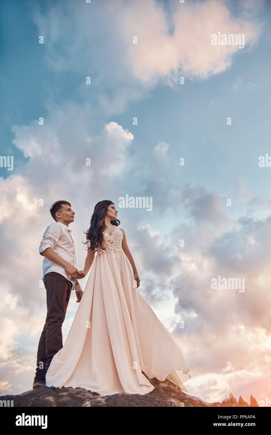 Love kiss and hugs in love couples at sunset in the evening sun, a walk ...