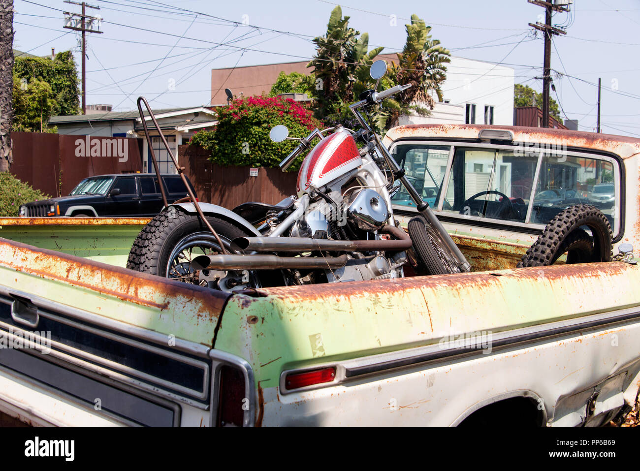 A view of a motorcycle in a vintage pick up truck trunk Stock Photo - Alamy