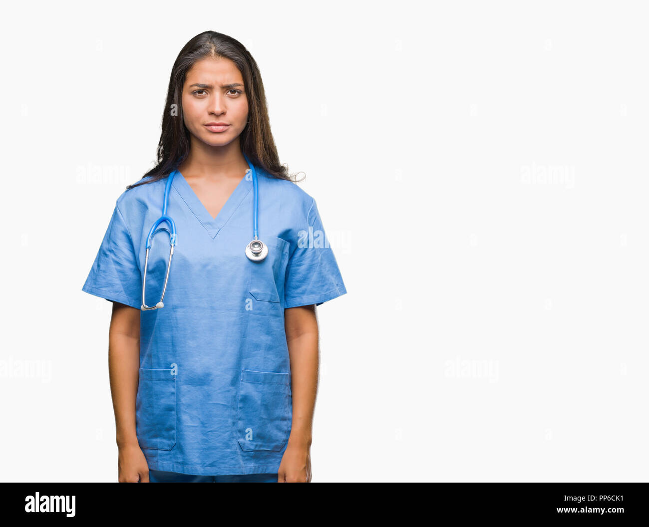 Young arab doctor surgeon woman over isolated background skeptic and ...