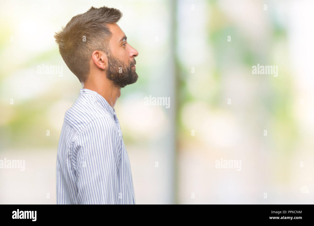 Adult hispanic man over isolated background looking to side, relax ...