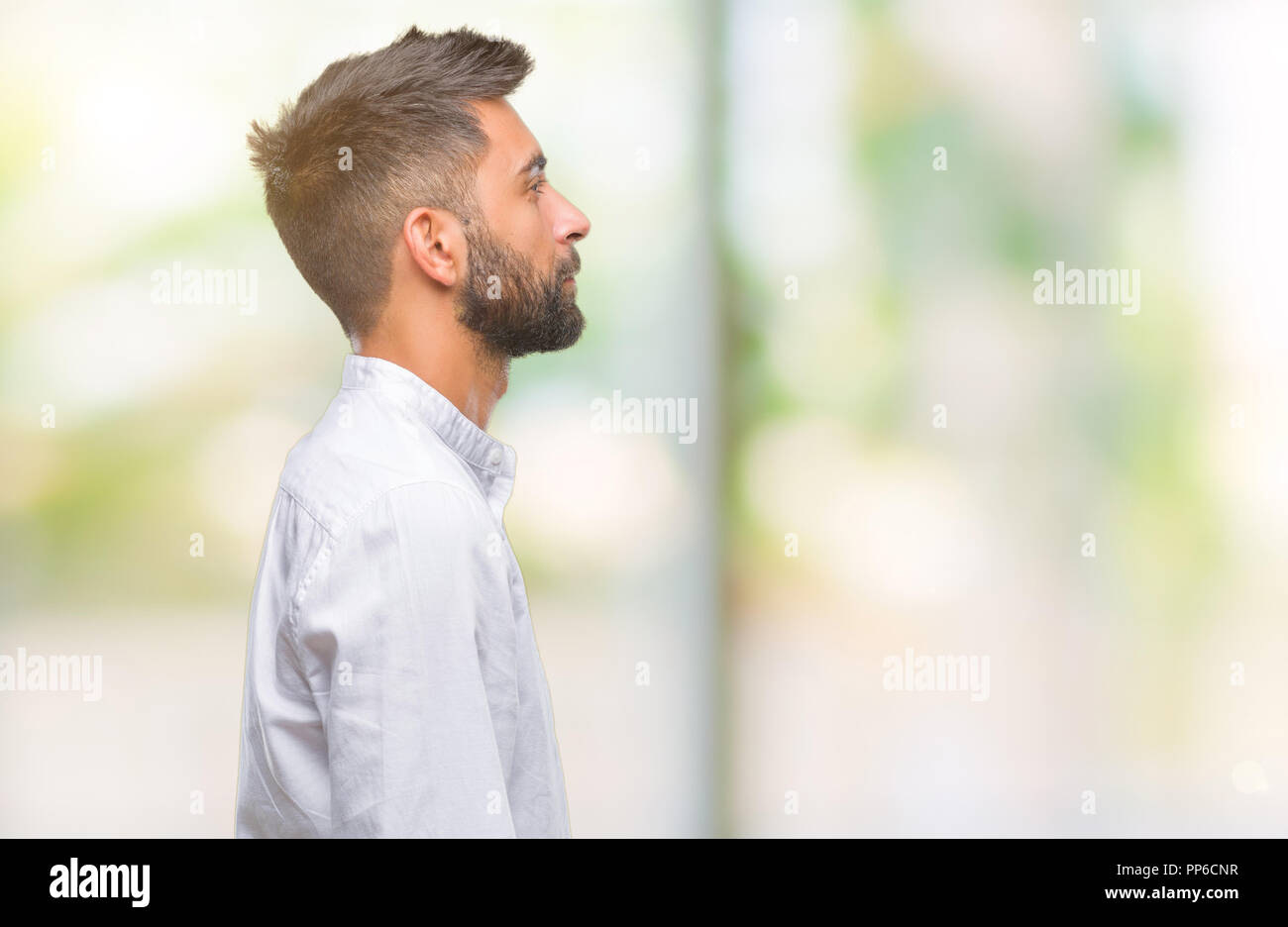 Adult hispanic man over isolated background looking to side, relax ...