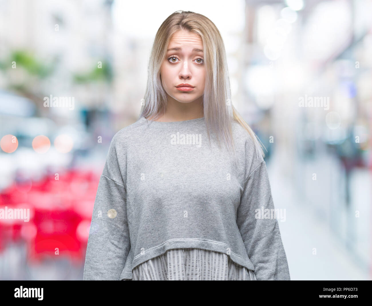 Young blonde woman over isolated background depressed and worry for ...