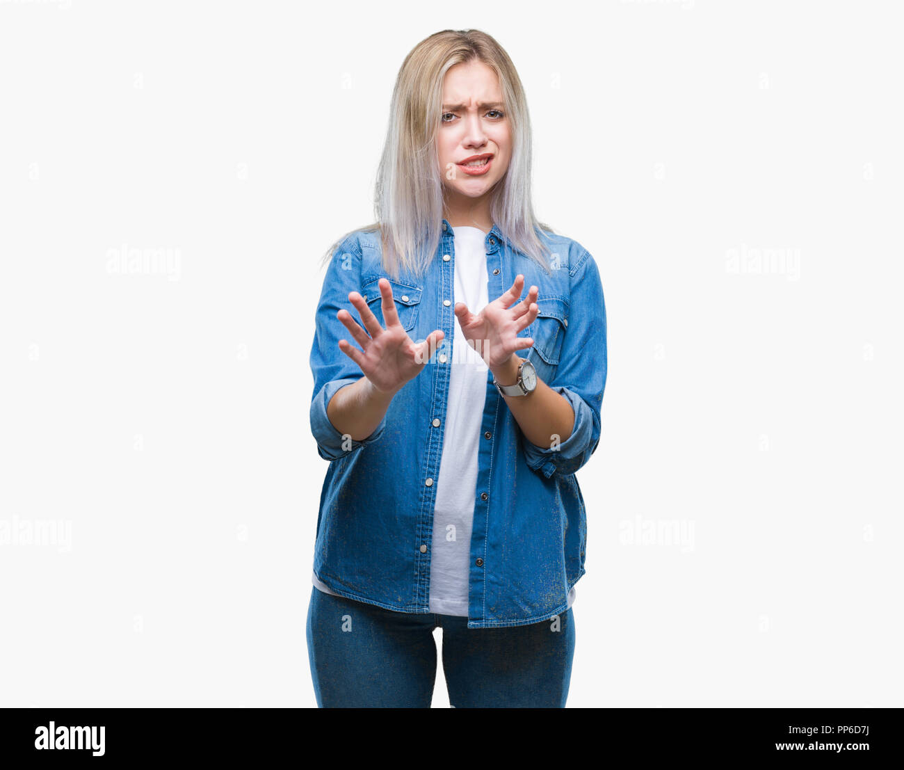 Young blonde woman over isolated background disgusted expression ...