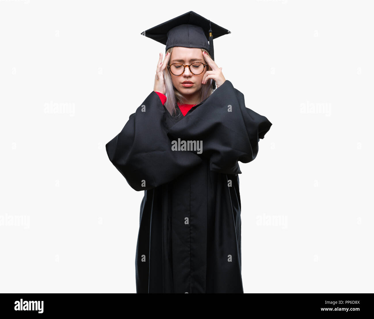 Young blonde woman wearing graduate uniform over isolated background ...