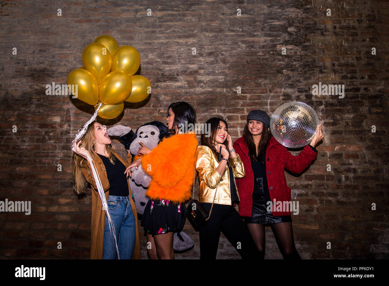 Group of happy girls having party in a club - Four young women having a ...