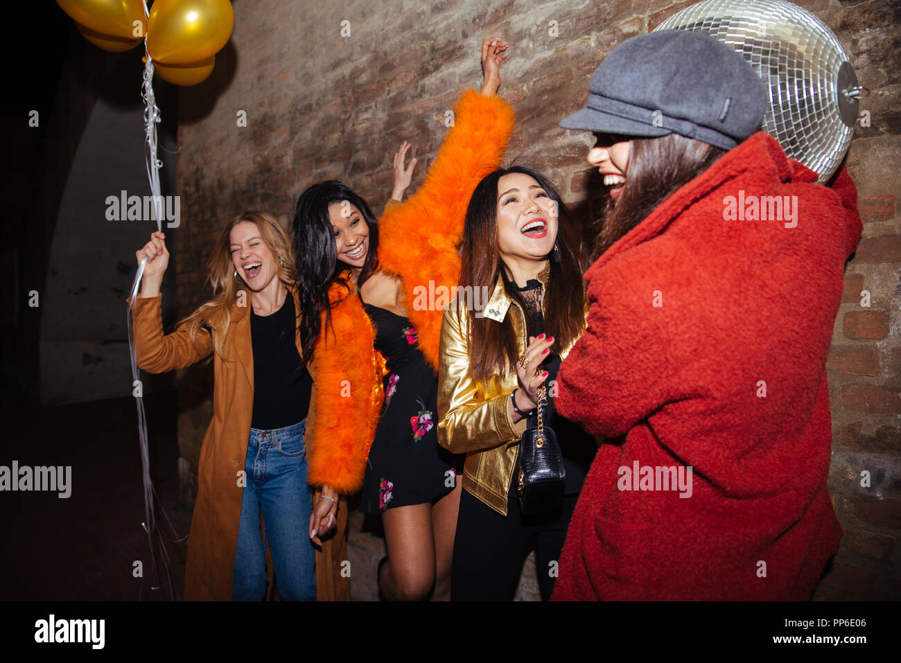 Group of happy girls having party in a club - Four young women having a ...
