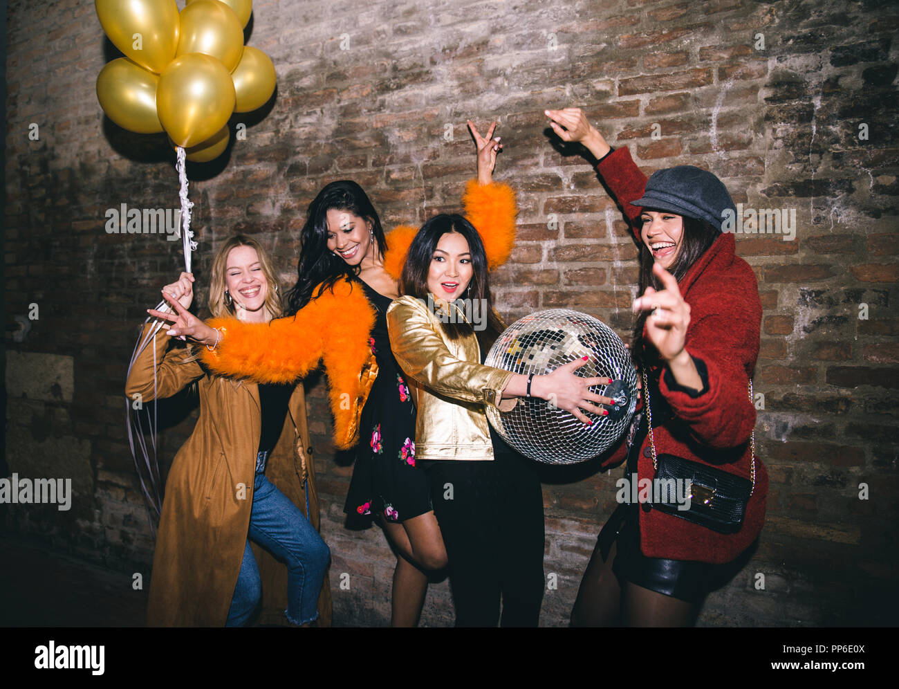 Group of happy girls having party in a club - Four young women having a ...