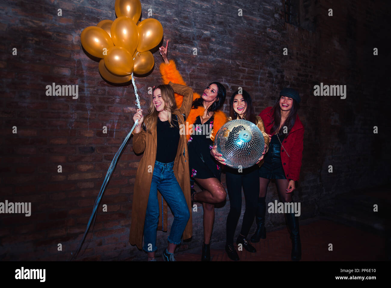 Group of happy girls having party in a club - Four young women having a ...