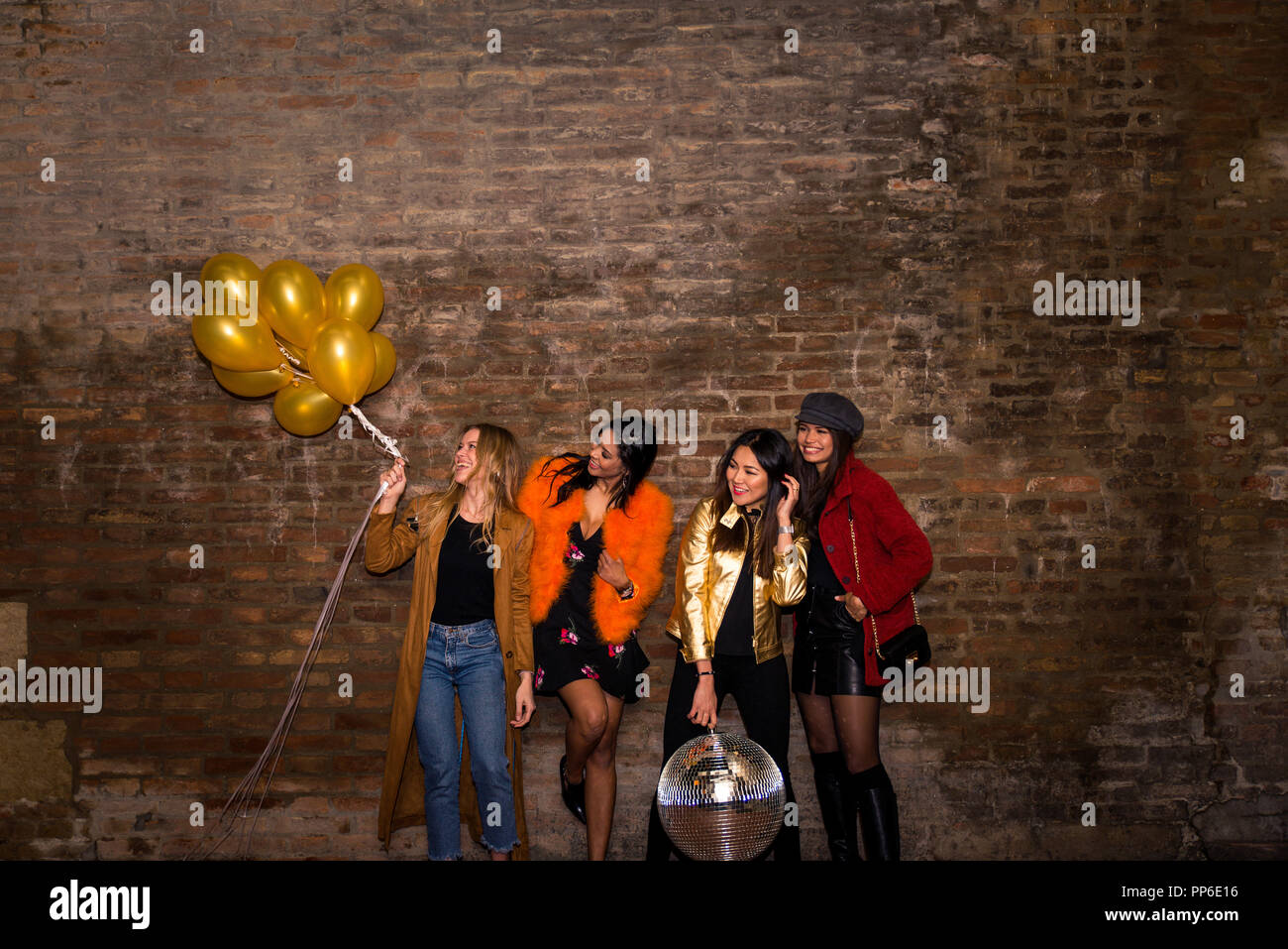 Group of happy girls having party in a club - Four young women having a ...