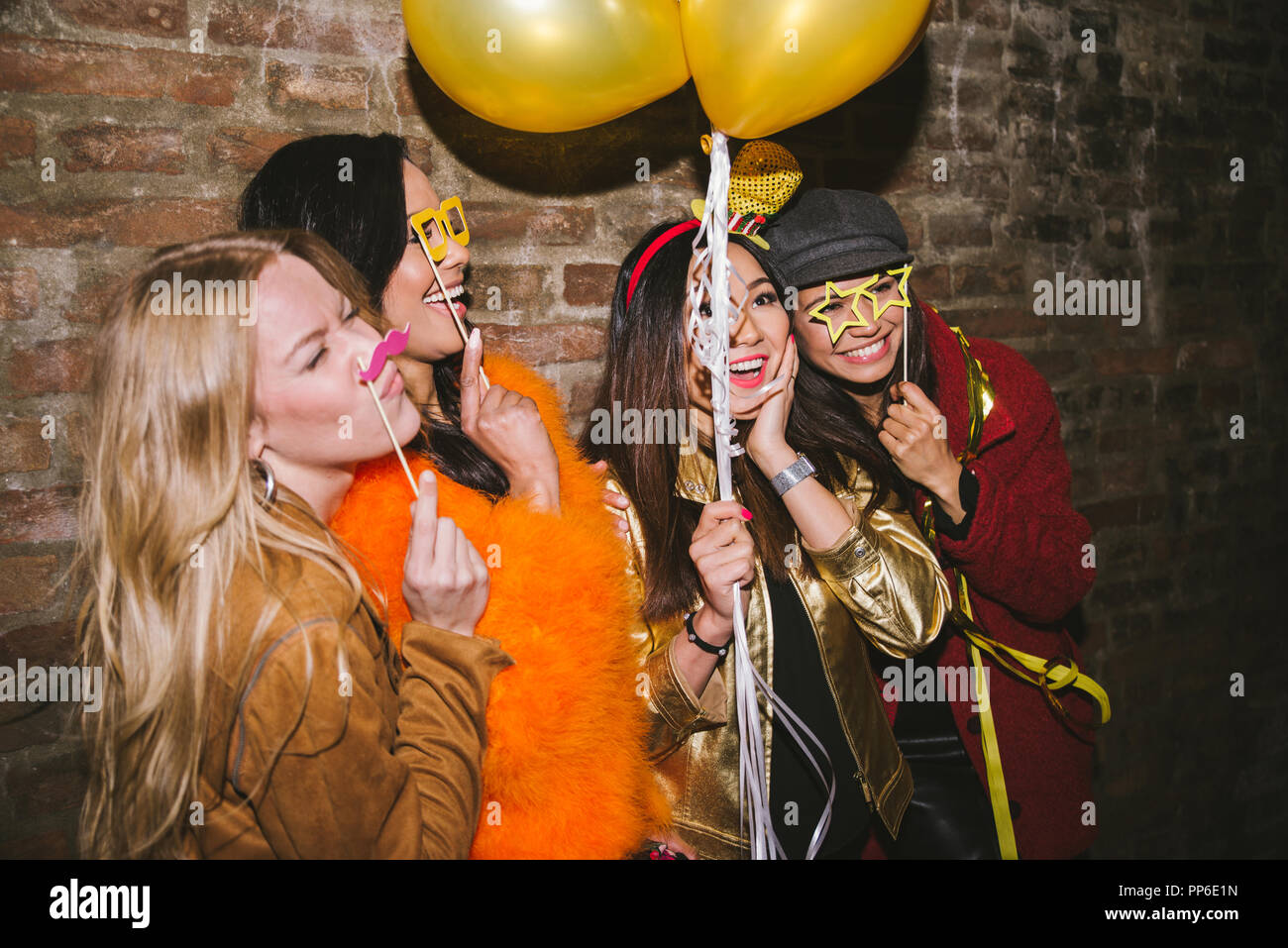 Group of happy girls having party in a club - Four young women having a ...