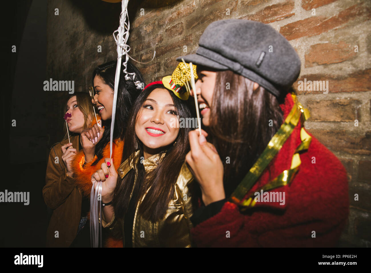 Group of happy girls having party in a club - Four young women having a ...