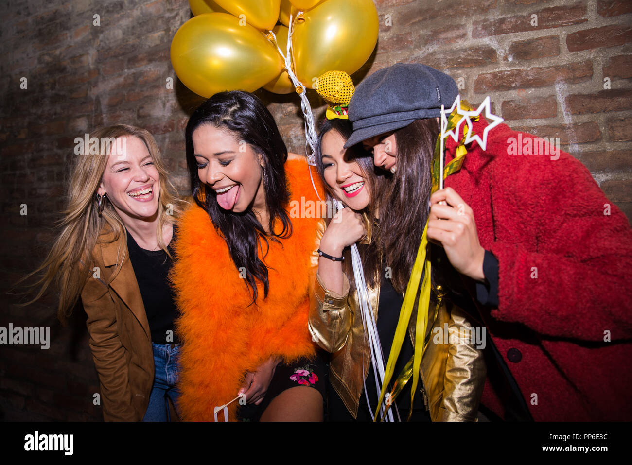 Group of happy girls having party in a club - Four young women having a ...