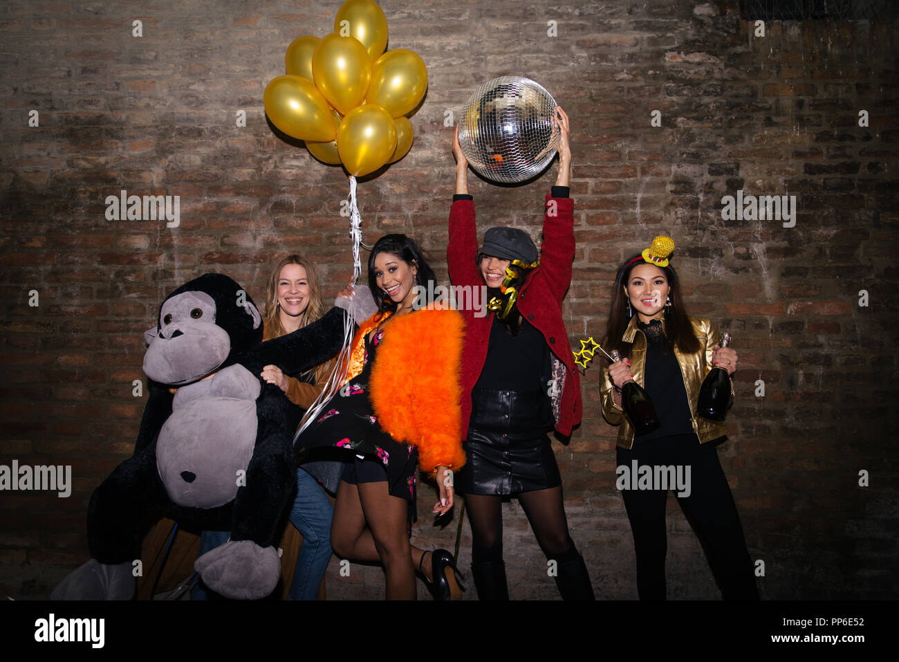Group of happy girls having party in a club - Four young women having a ...