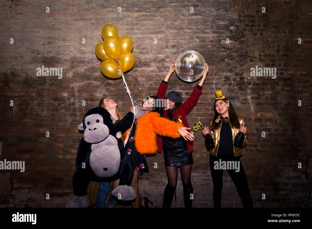 Group of happy girls having party in a club - Four young women having a ...