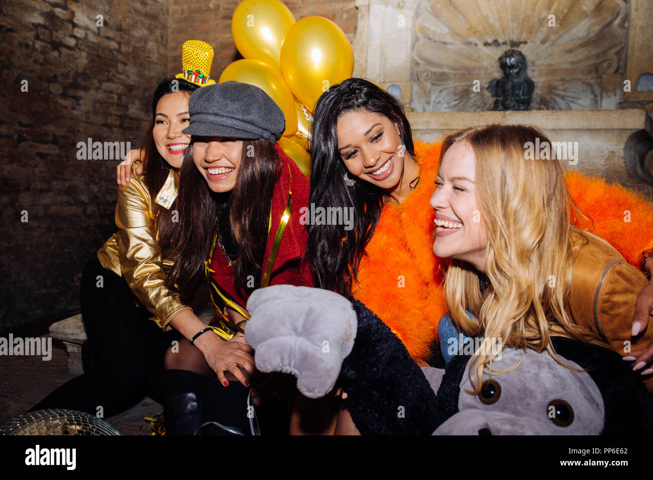 Group of happy girls having party in a club - Four young women having a ...