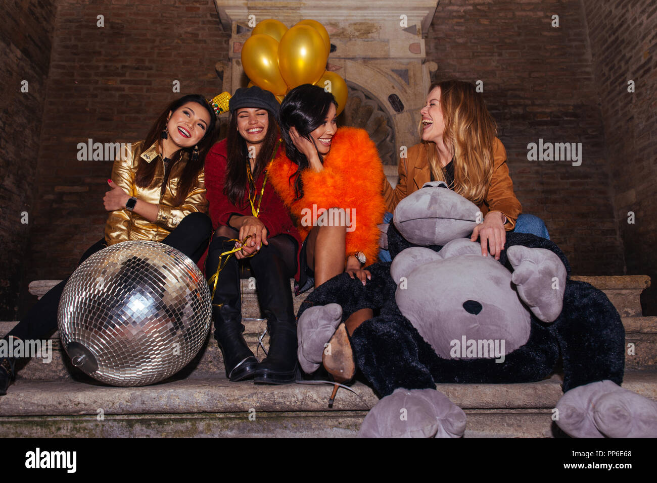 Group of happy girls having party in a club - Four young women having a ...