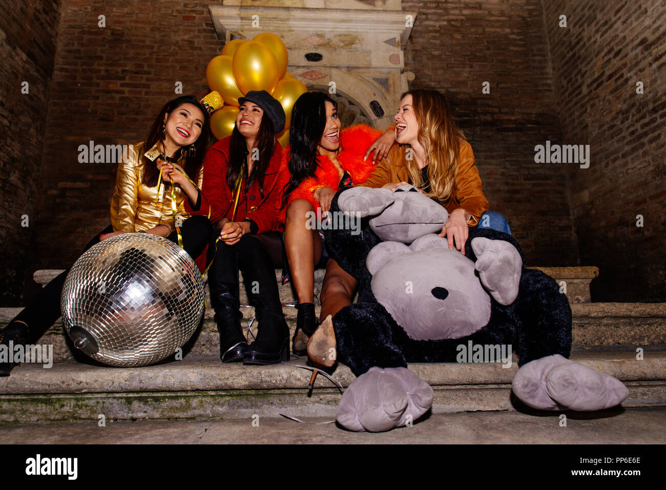 Group of happy girls having party in a club - Four young women having a ...