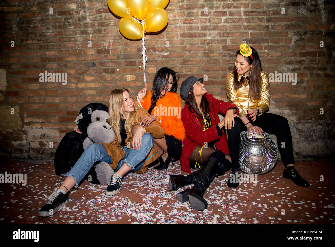 Group of happy girls having party in a club - Four young women having a ...