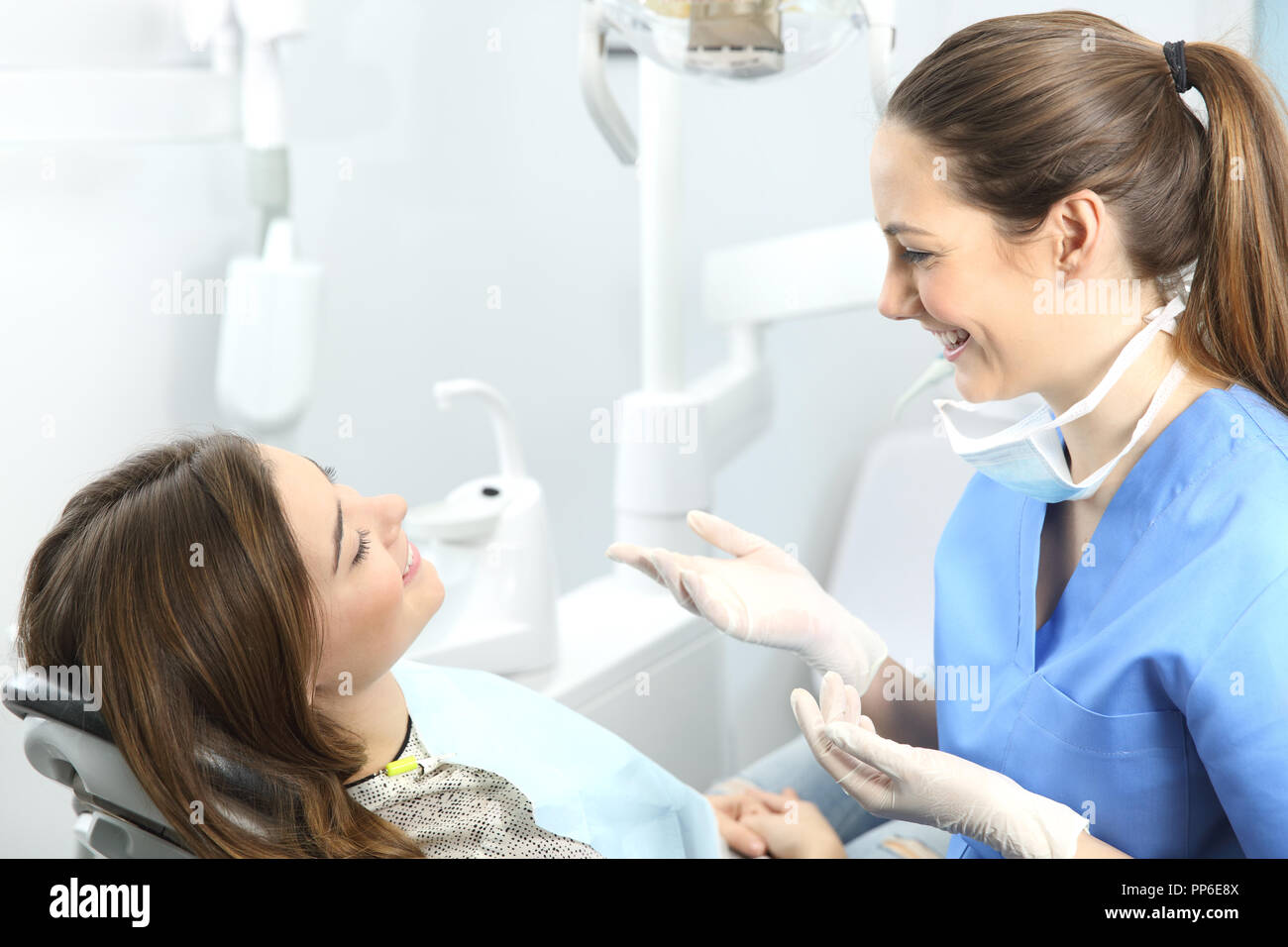 Dentist explaining procedures to a patient in a consultation Stock ...