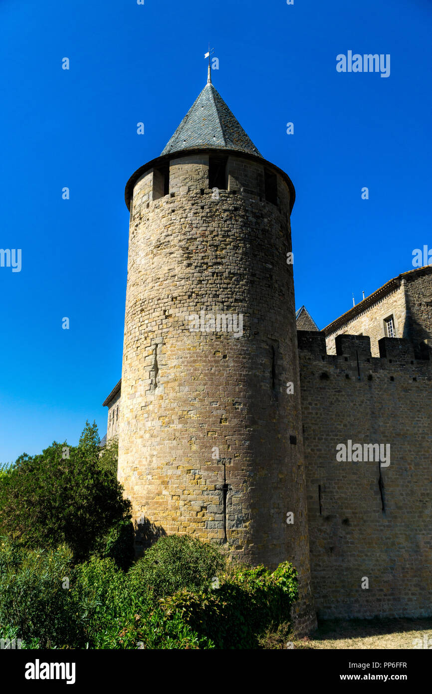 Large round tower with battlements and fortress wall in the historic ...