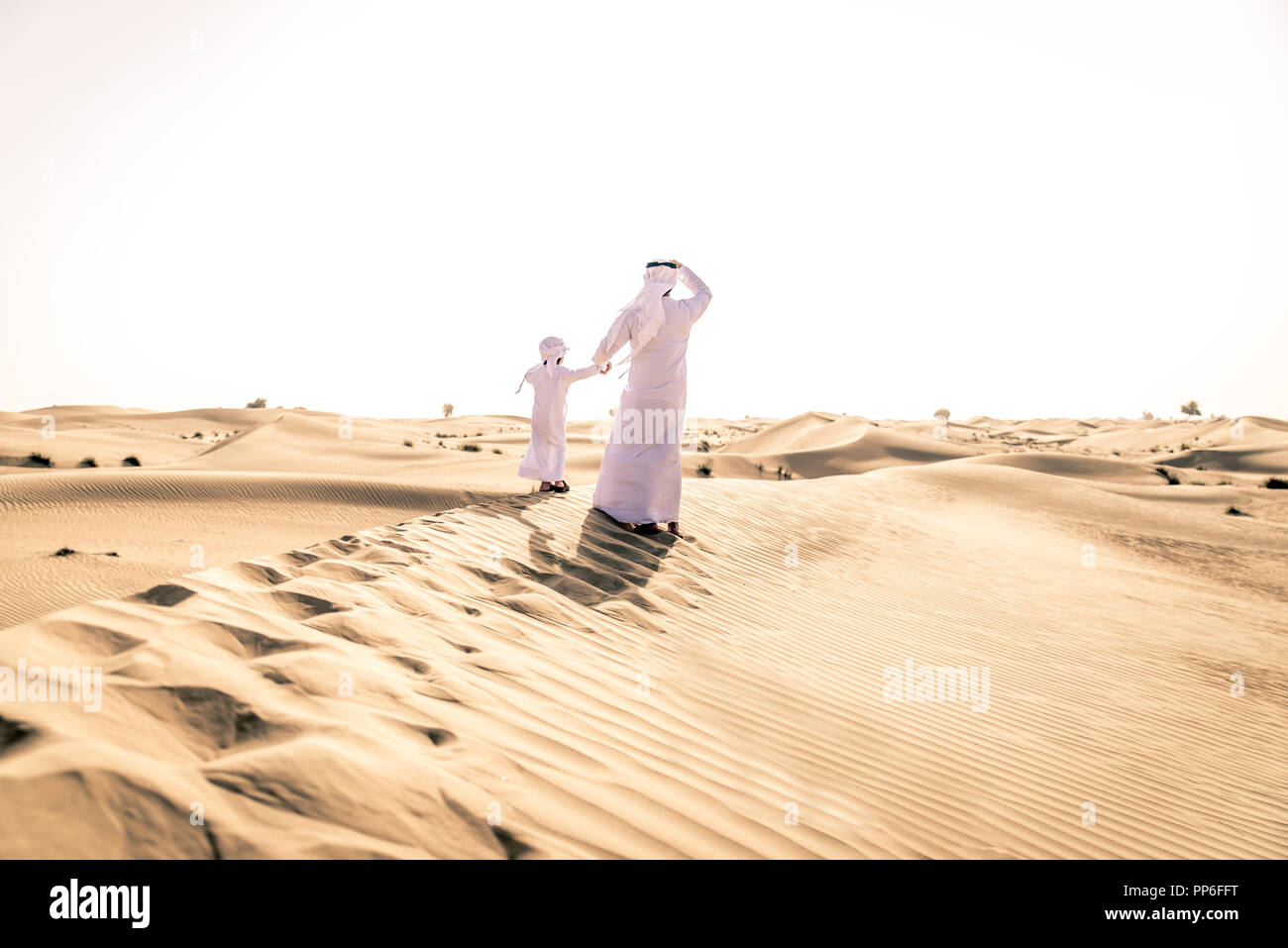 Happy family playing in the desert of Dubai - Playful father and his ...