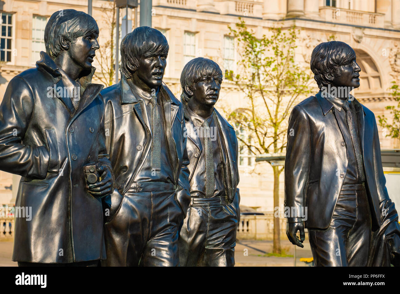 Liverpool, UK - May 17 2018: Bronze statue of the Beatles stands at the ...