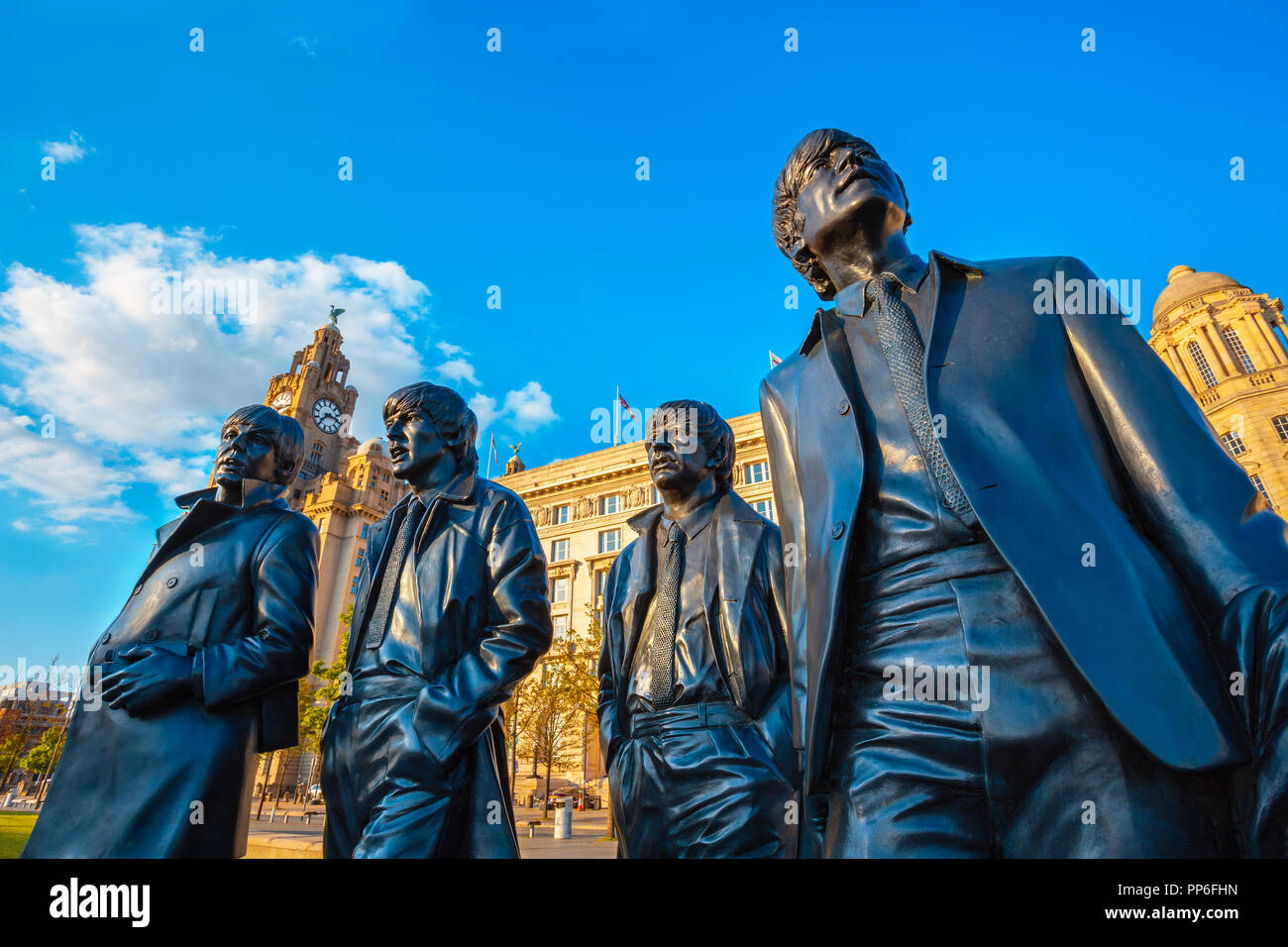 Liverpool, UK - May 17 2018: Bronze statue of the Beatles stands at the ...