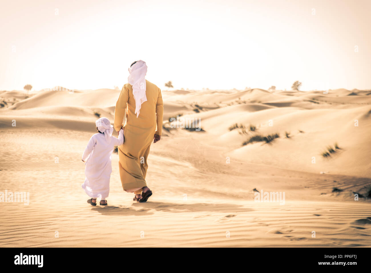 Happy family playing in the desert of Dubai - Playful father and his ...