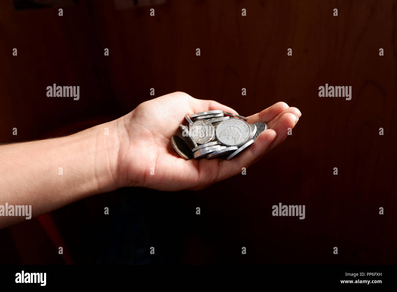 Gold coin donation hi-res stock photography and images - Alamy