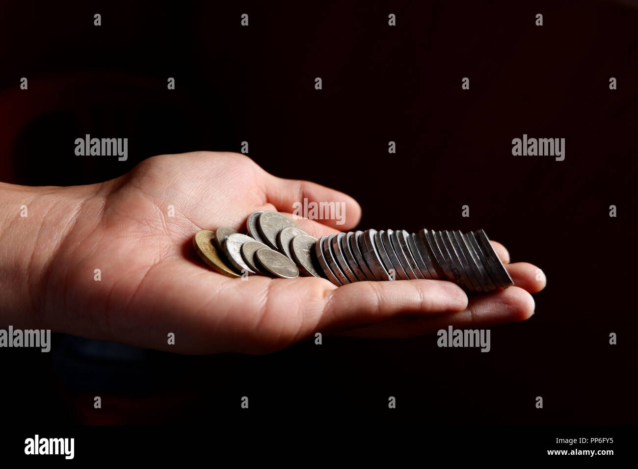 Handful of coins hi-res stock photography and images - Alamy