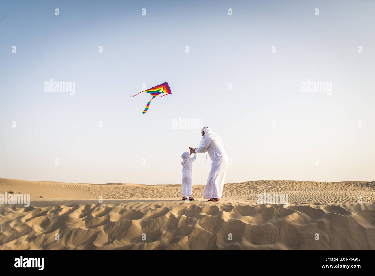 Happy family playing in the desert of Dubai - Playful father and his ...