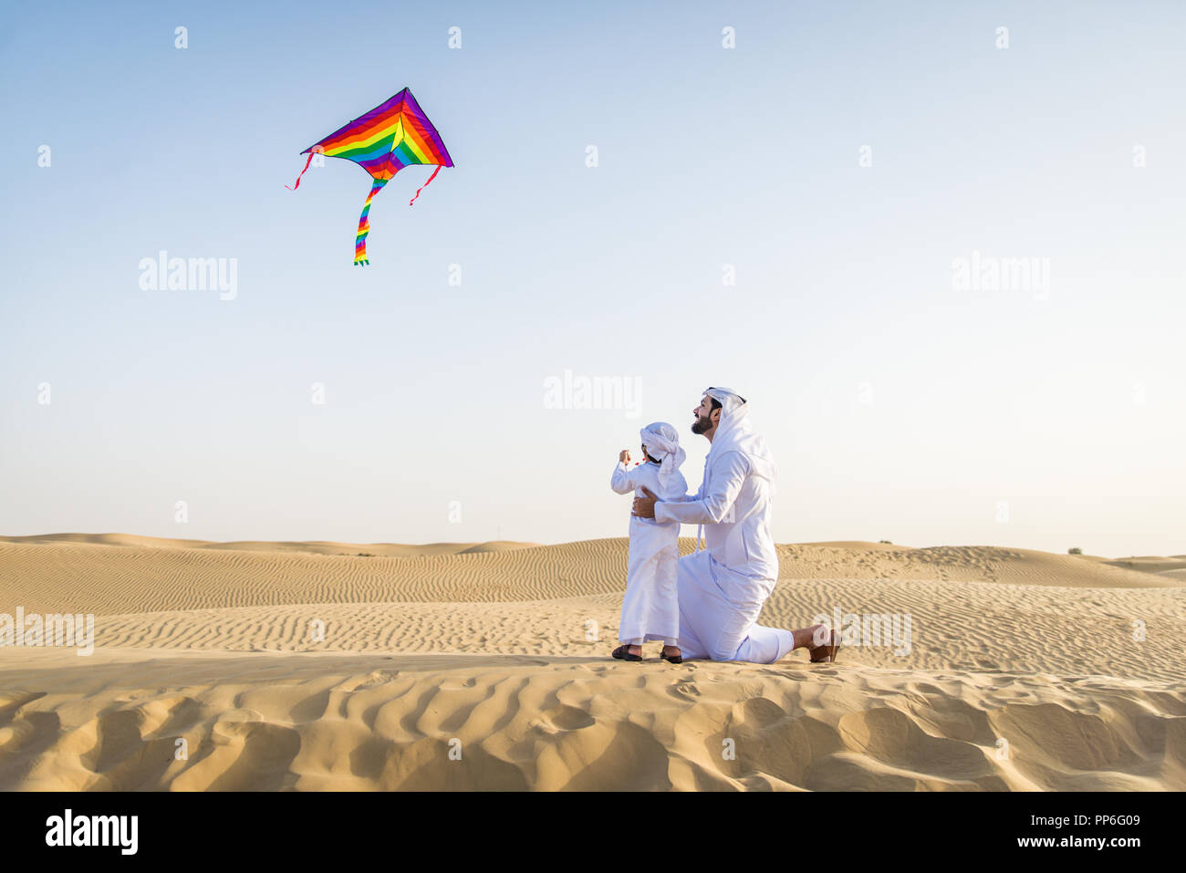 Happy family playing in the desert of Dubai - Playful father and his ...