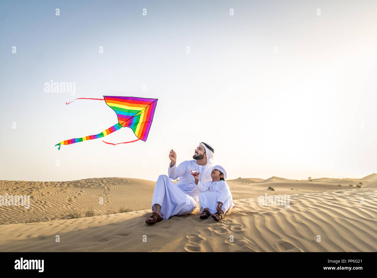 Happy family playing in the desert of Dubai - Playful father and his ...