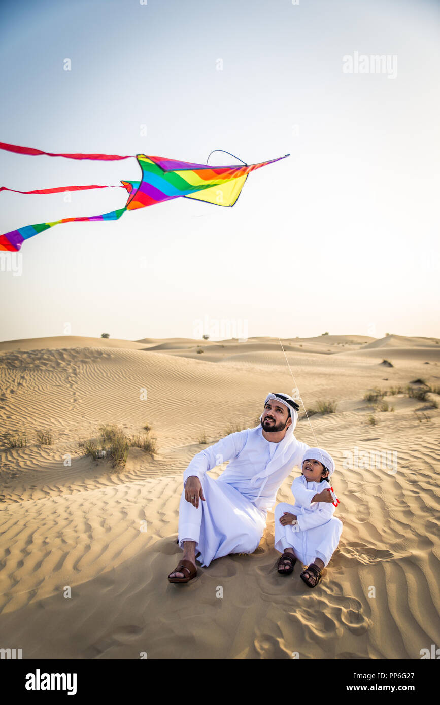Happy family playing in the desert of Dubai - Playful father and his ...