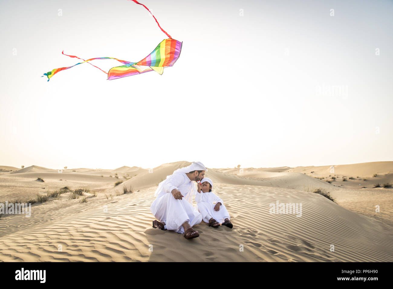 Happy family playing in the desert of Dubai - Playful father and his ...
