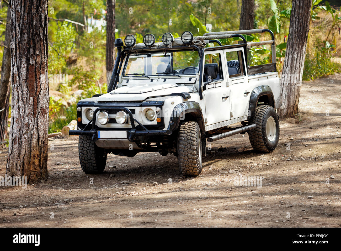 White 4x4 off road car in the forest. Photo of offroad Stock Photo - Alamy