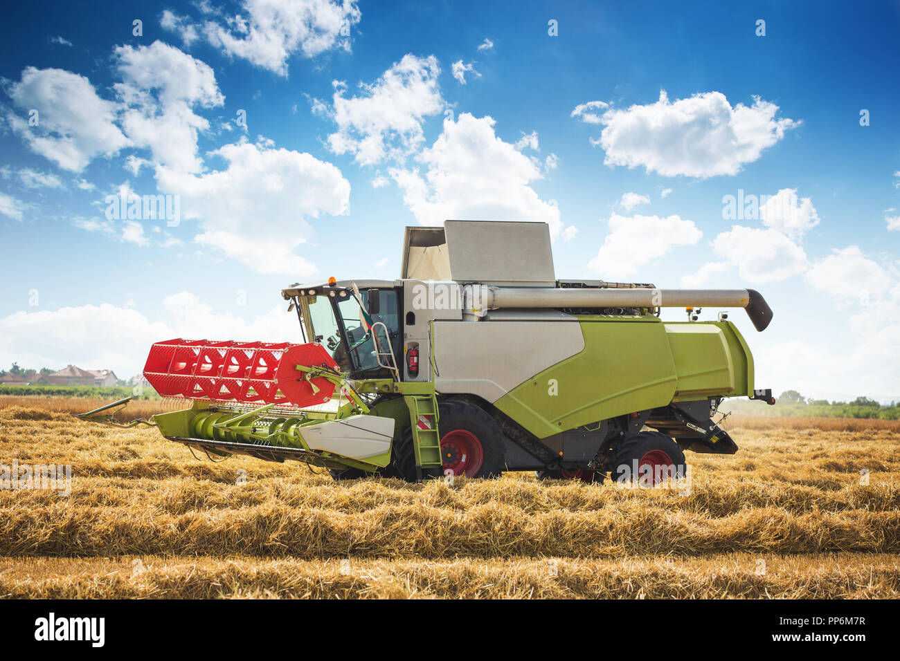 Grain harvester combines on wheat hi-res stock photography and images ...