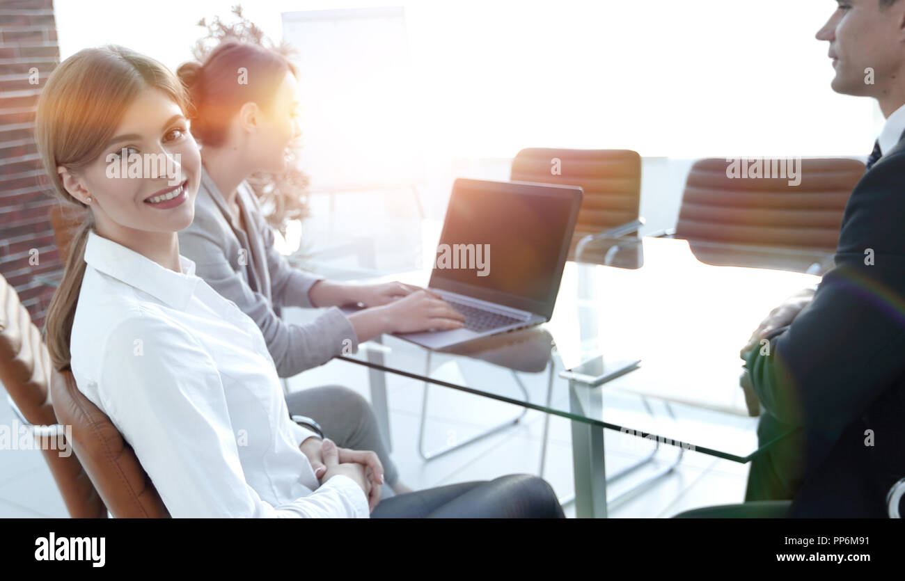 office workers sitting behind a Desk Stock Photo - Alamy