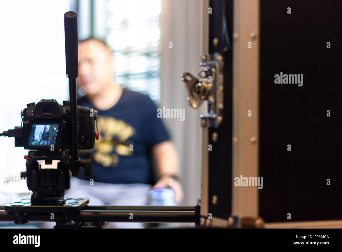 A video camera shooting in indoor location Stock Photo - Alamy
