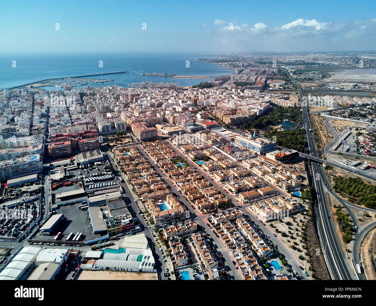 Aerial photo of harbour, residential houses, highways and Mediterranean ...