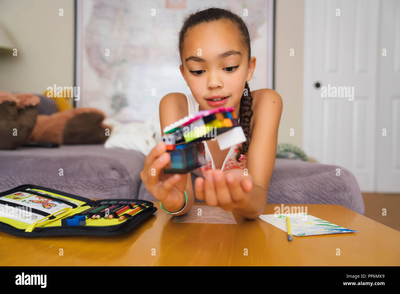 Tween Girl Playing with Building Blocks Stock Photo - Alamy