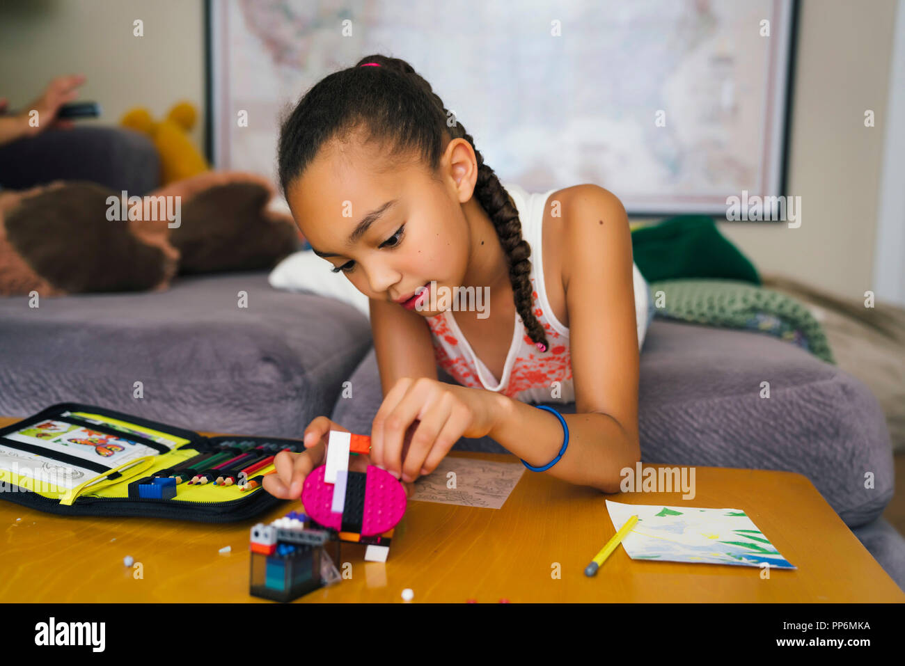 Tween Girl Playing with Building Blocks Stock Photo - Alamy