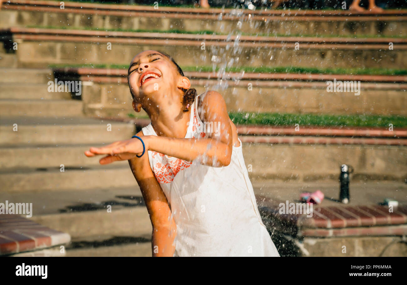 Cheerful wet teen girl hi-res stock photography and images - Alamy
